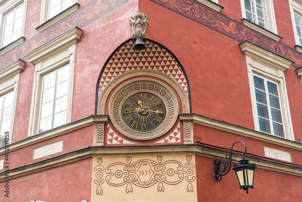 Ornamented historic clock at facade of a house at market square in the ...