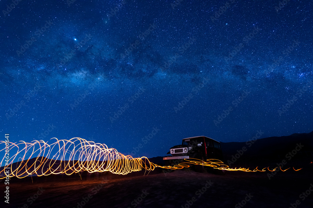 Indonesia, East Java, Spiral light trails in front of car parked in ...