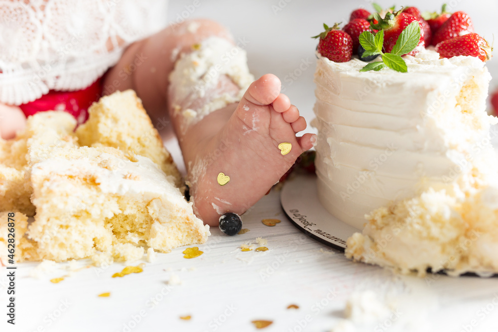Baby foot on a festive background whith cake Stock Photo | Adobe Stock