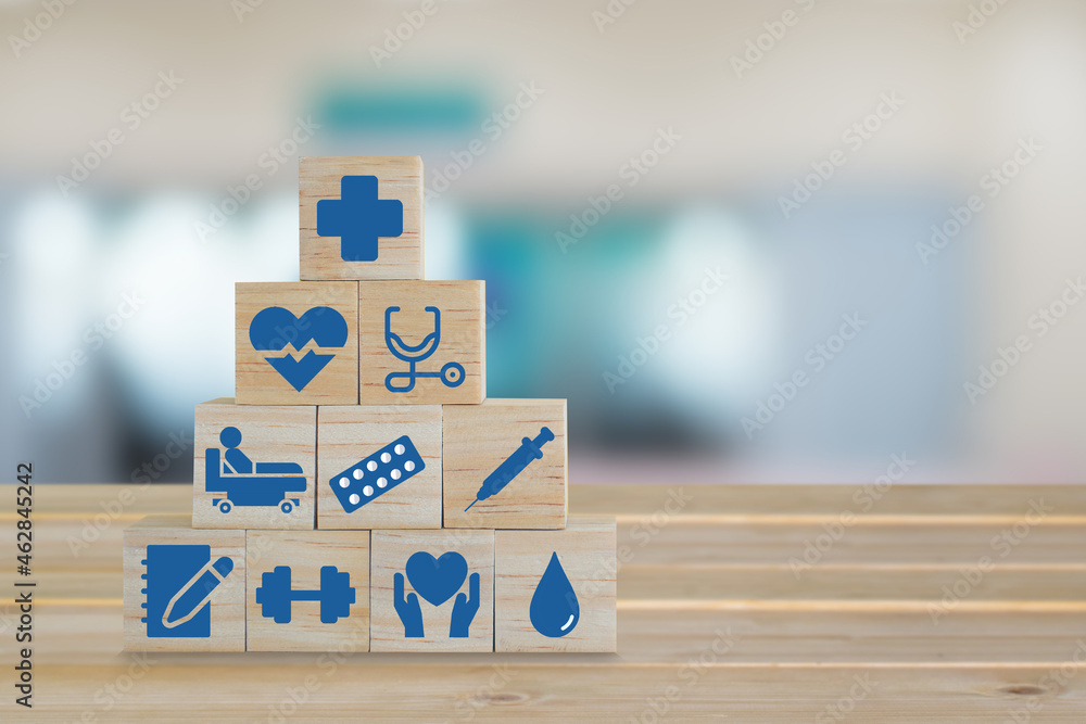 Wood block with healthcare medical icon on blurred background of ...