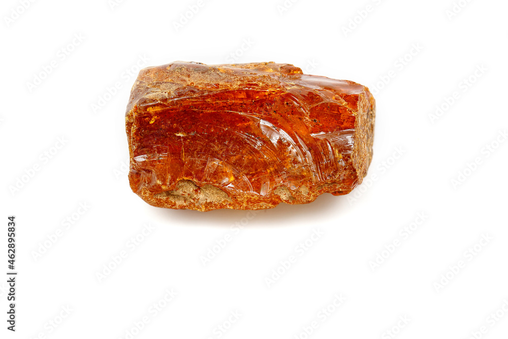 Shiny polished amber on a white background. Sun stone. A piece of ...