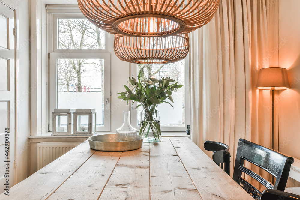 Dining room interior with furniture against window Stock Photo | Adobe ...