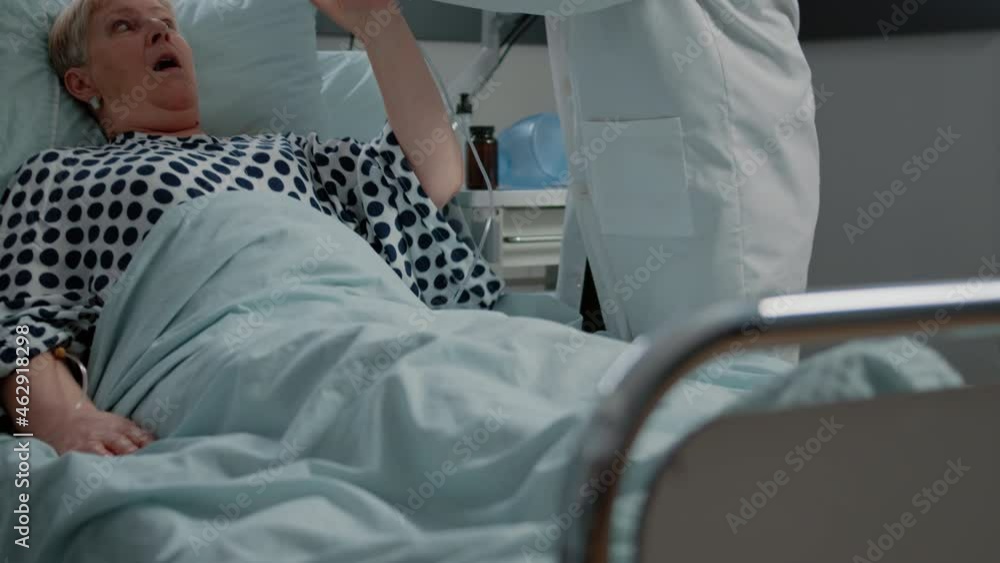 Medical team helping patient with respiratory disease, using oxygen ...