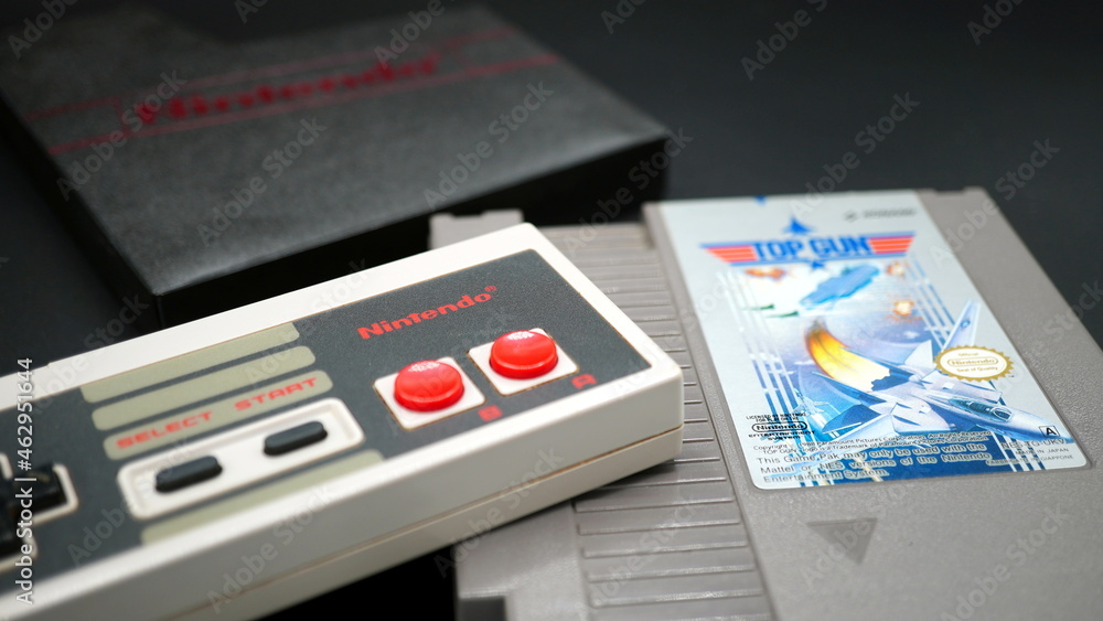 Rome, 02 January 2020: Cartridge with case and Nintendo game controller ...