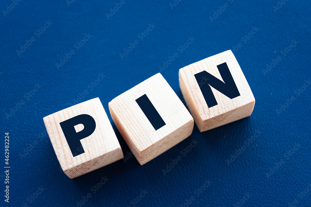 Word PIN -Personal identification number. Wooden small cubes with ...