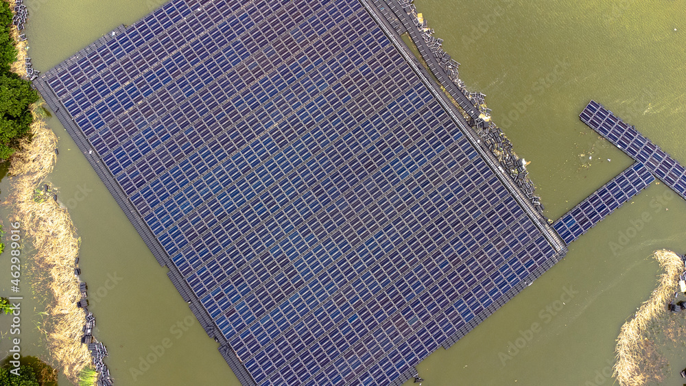 Solar panels on water in aerial view, rows array of polycrystalline ...
