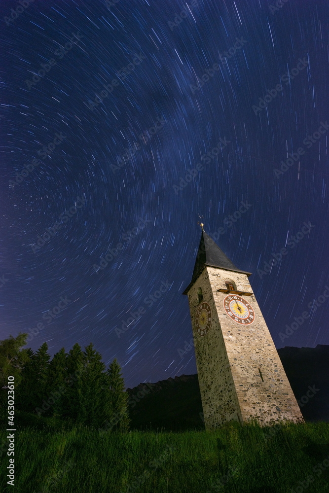 church bell tower at night with star trails in the night sky Stock ...