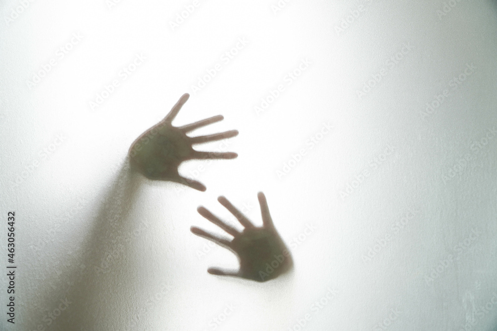 shadow of the right hand and left behind the glass is wet.Left and ...