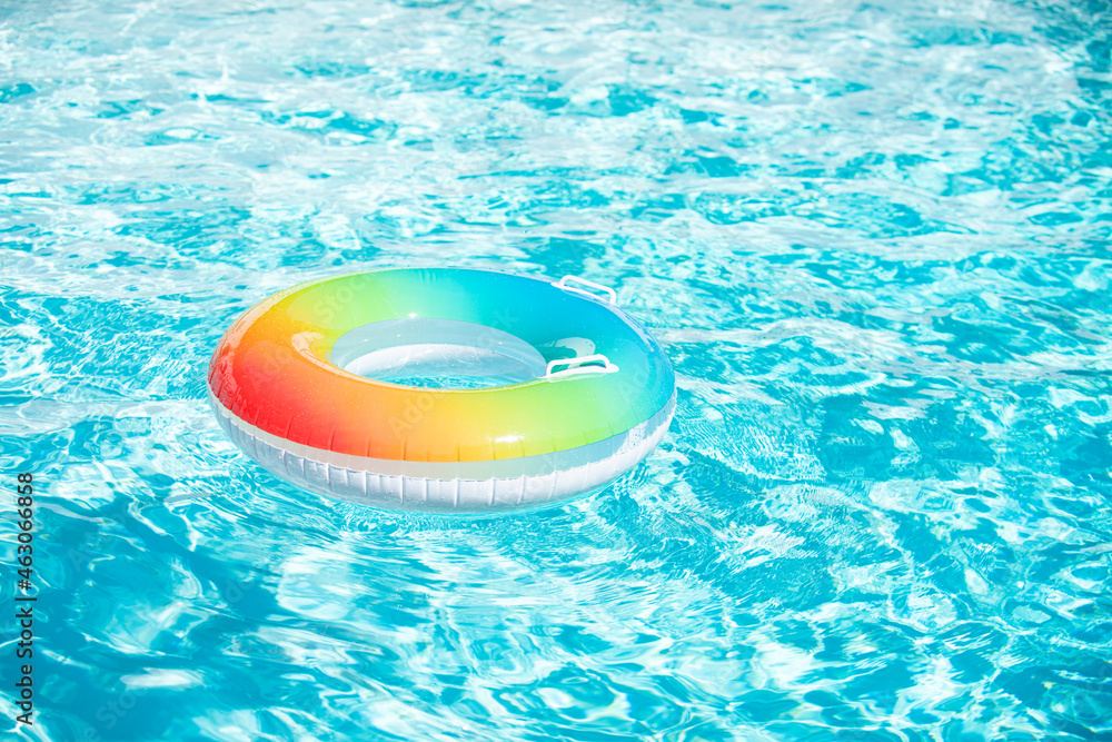 Pool float, floating in a blue swimming pool. Summer background. Stock Photo | Adobe Stock