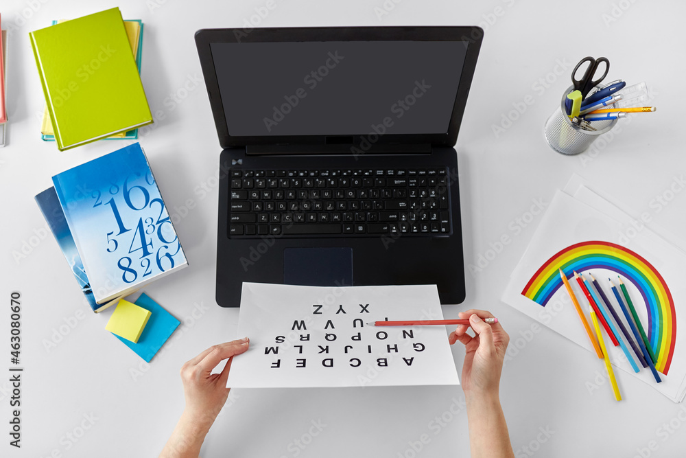 distant education, primary school and teaching concept - hands of ...