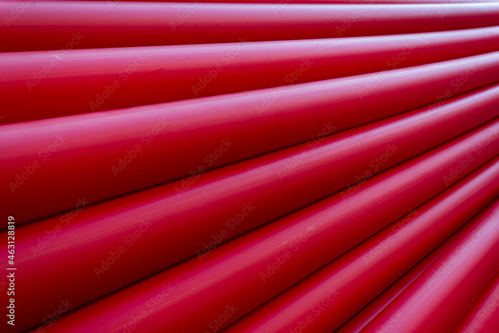 Red PVC plastic pipes for pipelines and optical cables to use as a ...