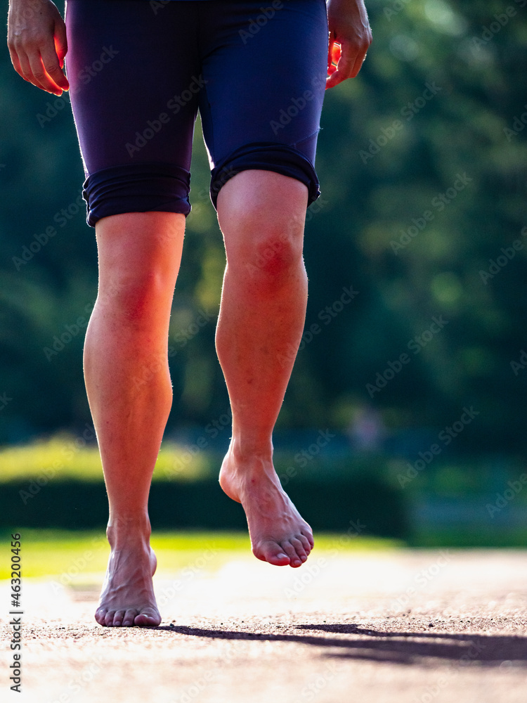Solid bare feet of a hard training woman runs along running track Stock ...