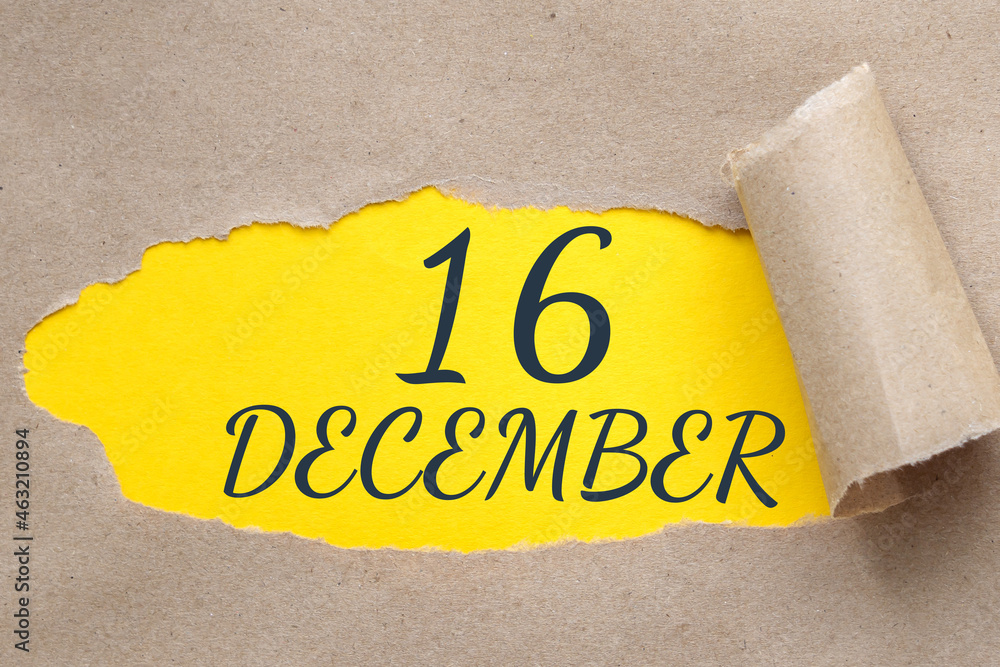 december 16. 16th day of the month, calendar date.Hole in paper with ...