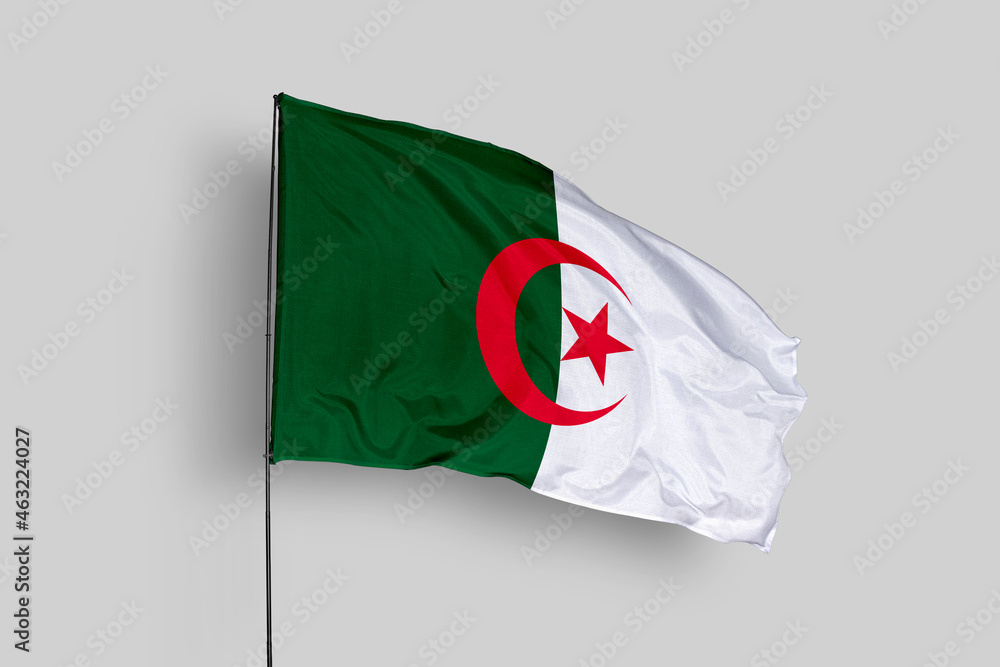 Algeria flag isolated on the blue sky background. close up waving flag ...