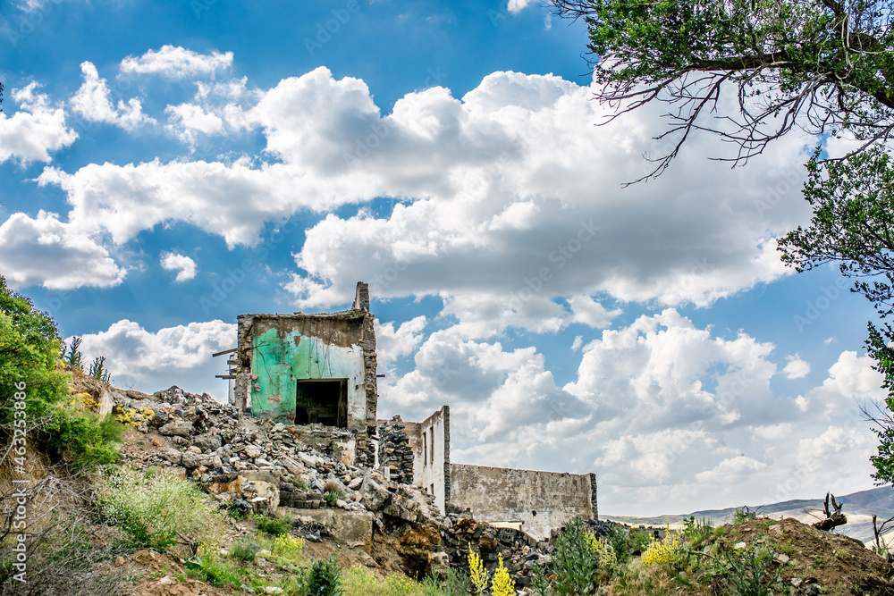 Destroyed and abandoned buildings of the city after the war, bombing or ...