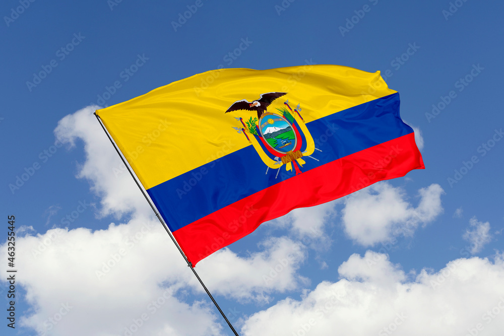 Ecuador flag isolated on the blue sky background. close up waving flag ...