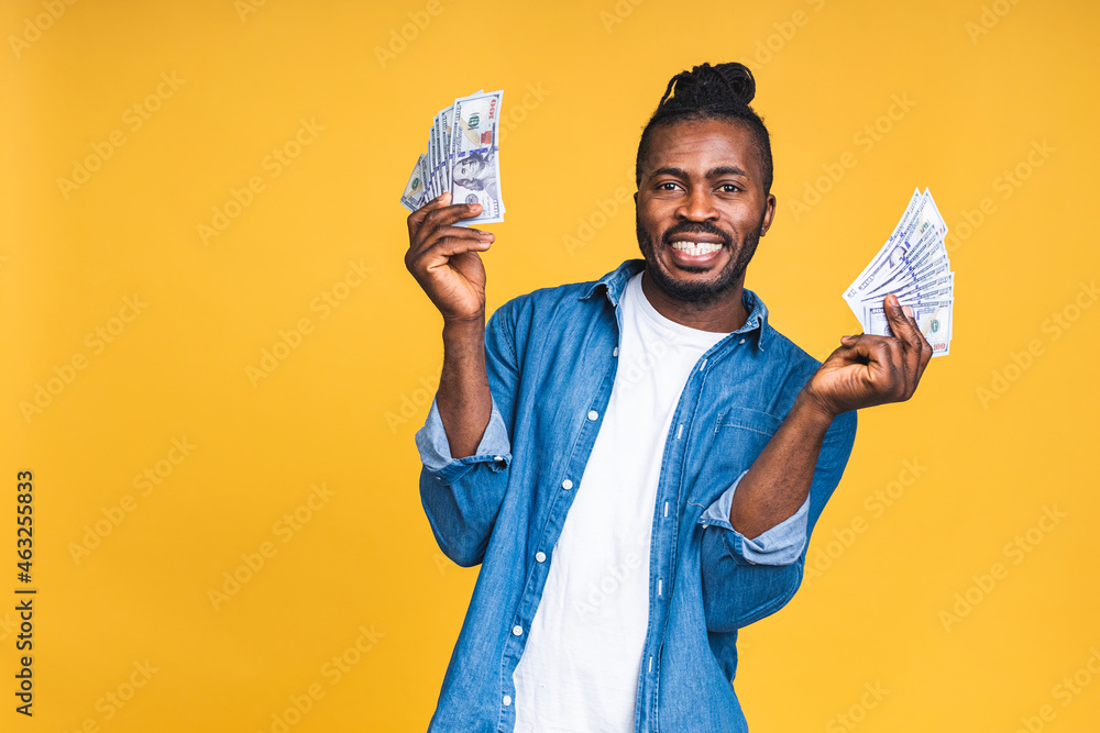 Happy winner! Young rich african american black man in casual holding ...