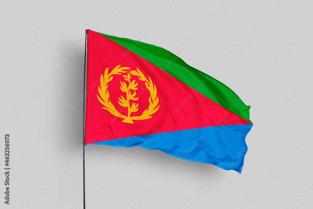 Eritrea flag isolated on the blue sky background. close up waving flag ...
