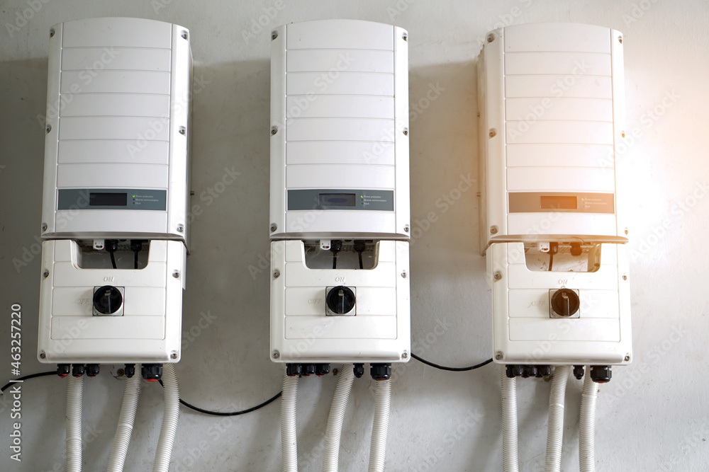Photovoltaic power converter system unit installed on wall. Electrical ...