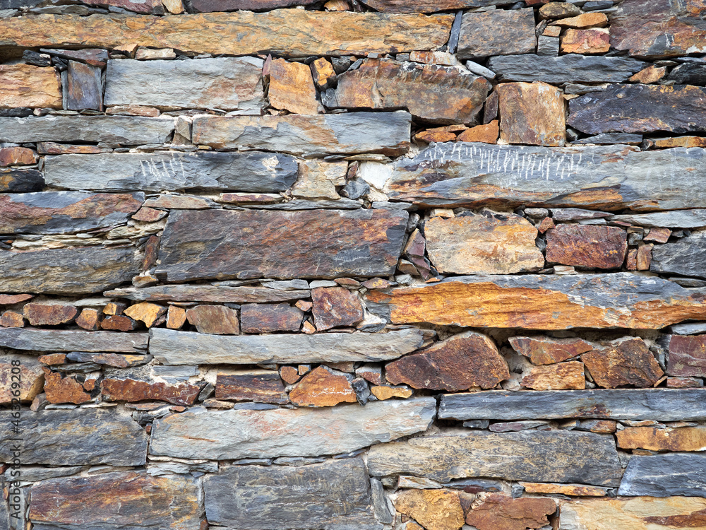 Wall of slate. Background os slate stones of different size and shape ...