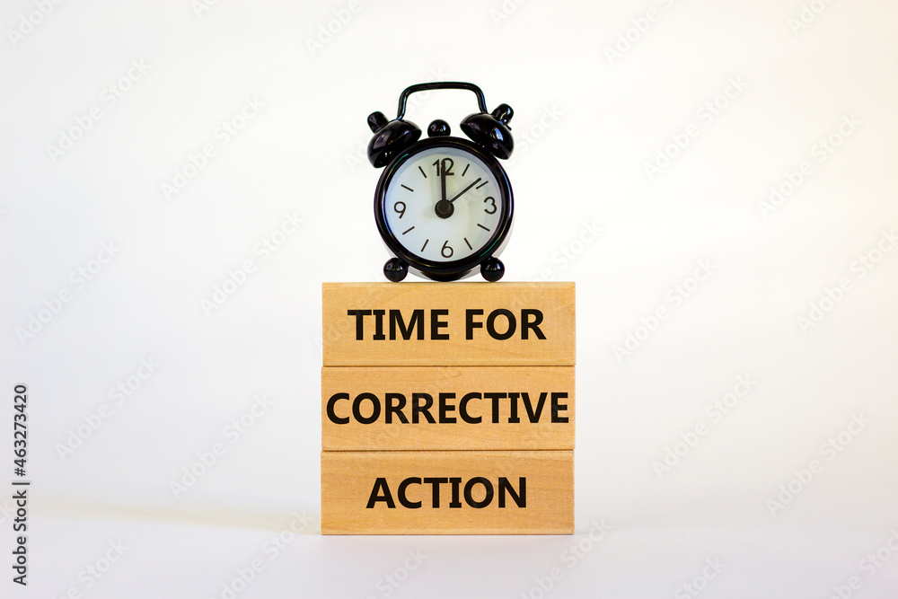 Time for corrective action symbol. Wooden blocks with words 'Time for ...