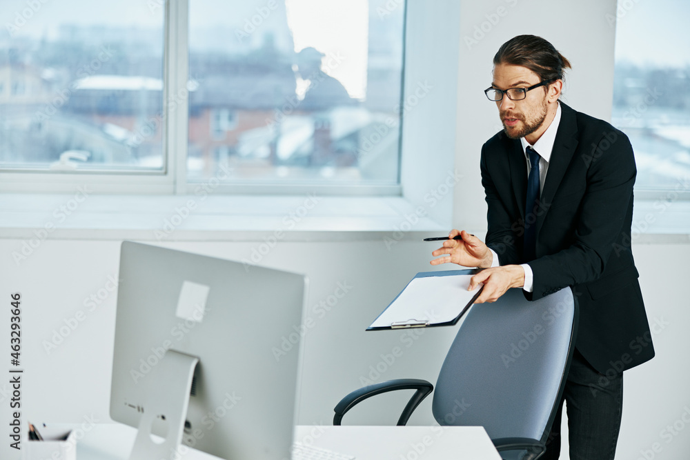 man in a suit at the desk with glasses work Lifestyle Stock Photo ...