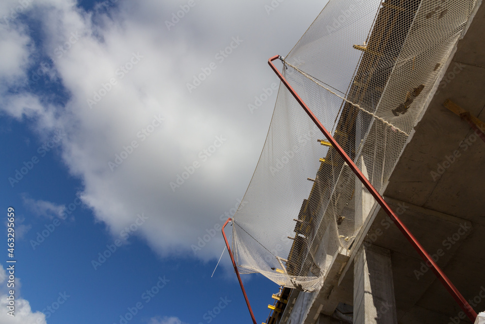 Construction safety net. A construction mesh that prevents objects from ...