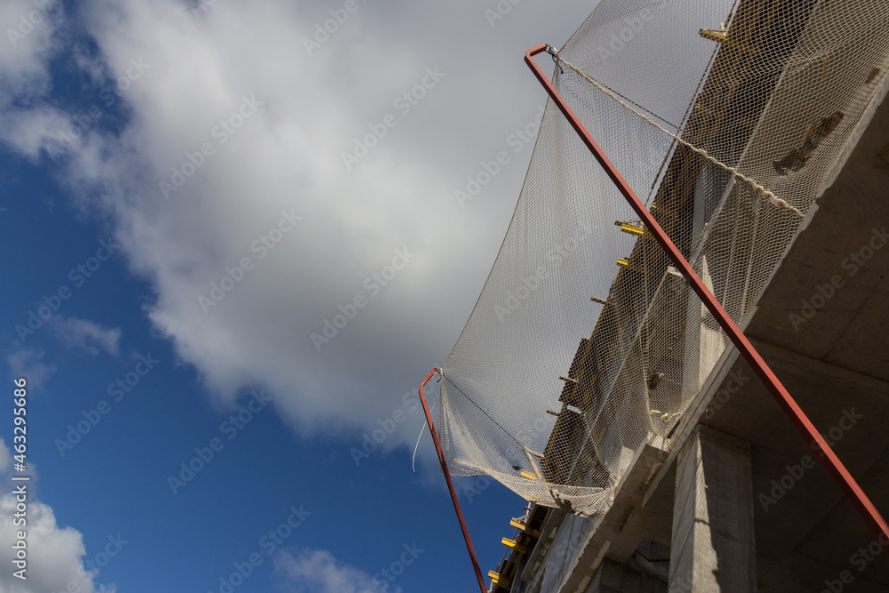 Construction safety net. A construction mesh that prevents objects from ...
