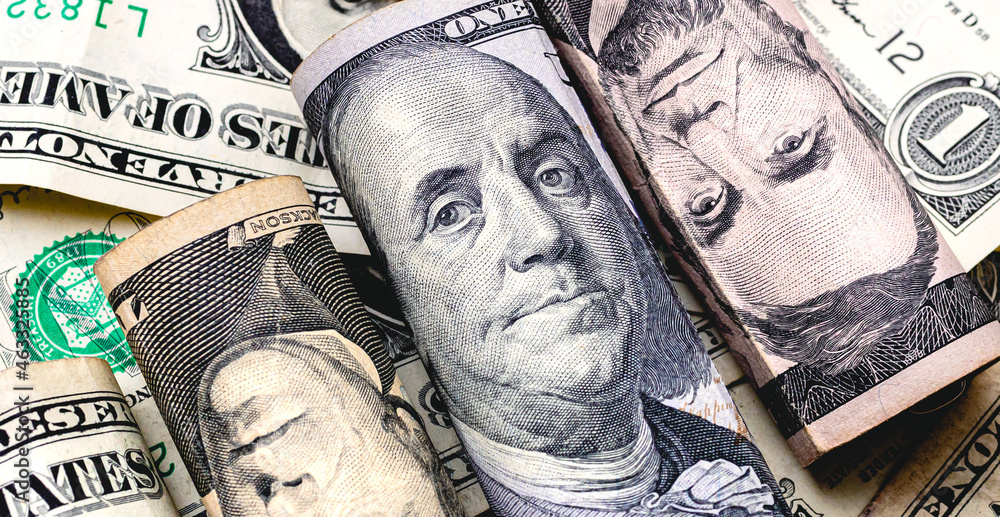 Dollar - USD. Money background with dollar banknotes rolled up in photo ...