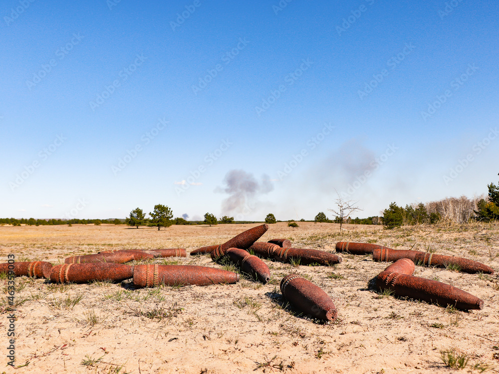 Old shells and bombs on the battlefield. Stock Photo | Adobe Stock