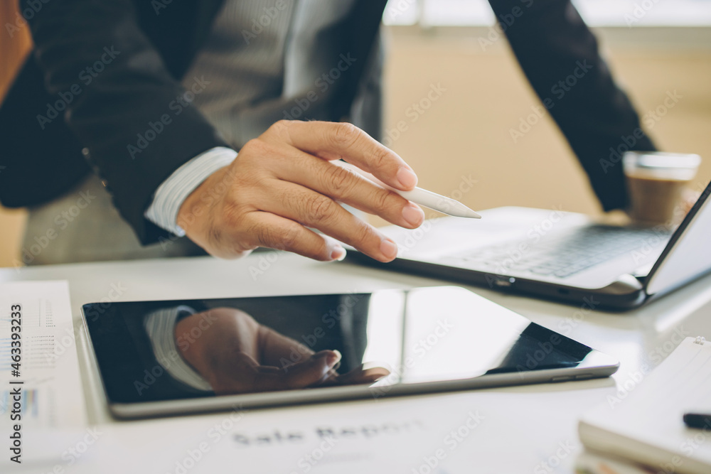 Digital marketing, businessman using smart tablet and documents on ...