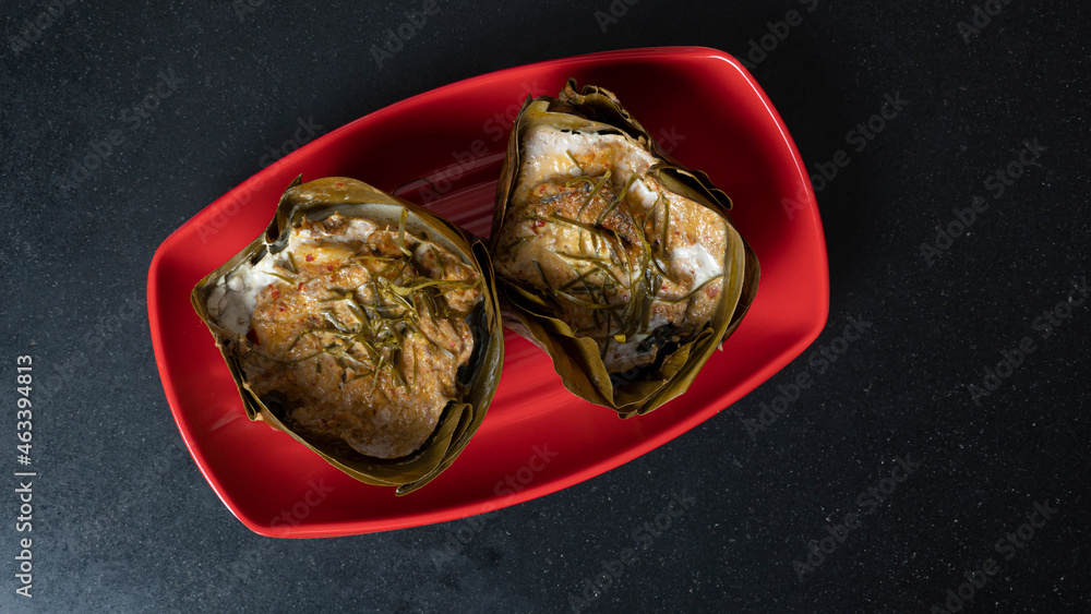 Top view steamed curry fish in banana leaf cups or Thailand name Hor ...