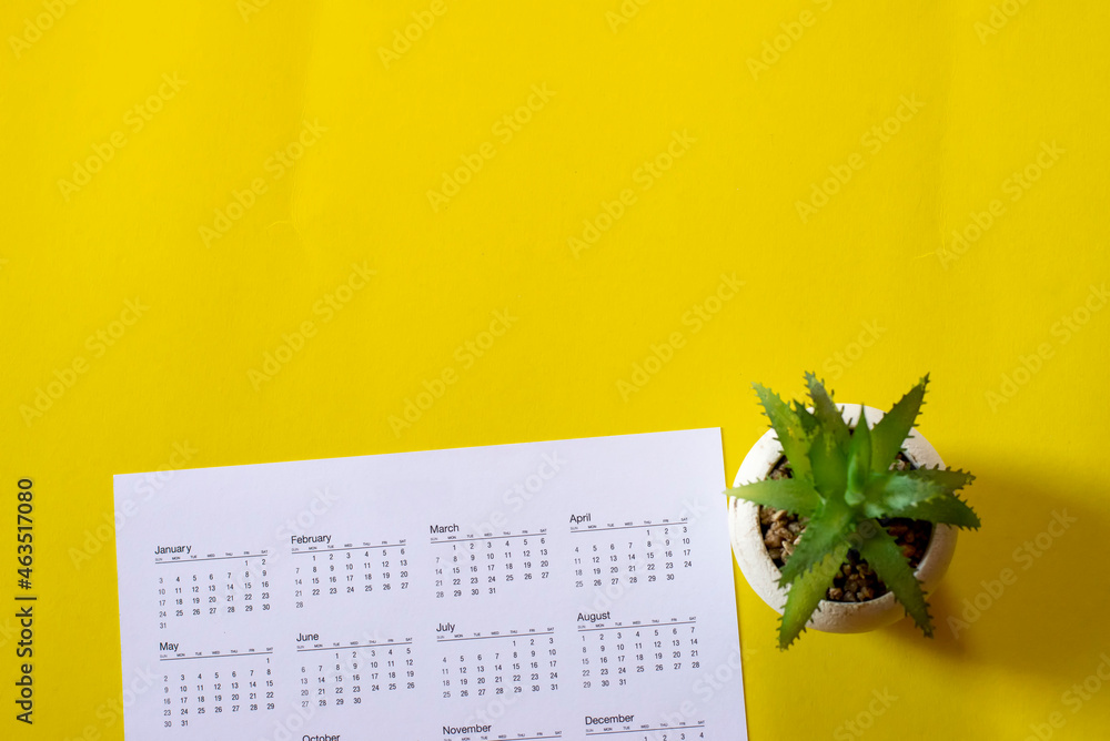 Top view Calendar place on yellow desk. Desktop Calender for Planner to ...