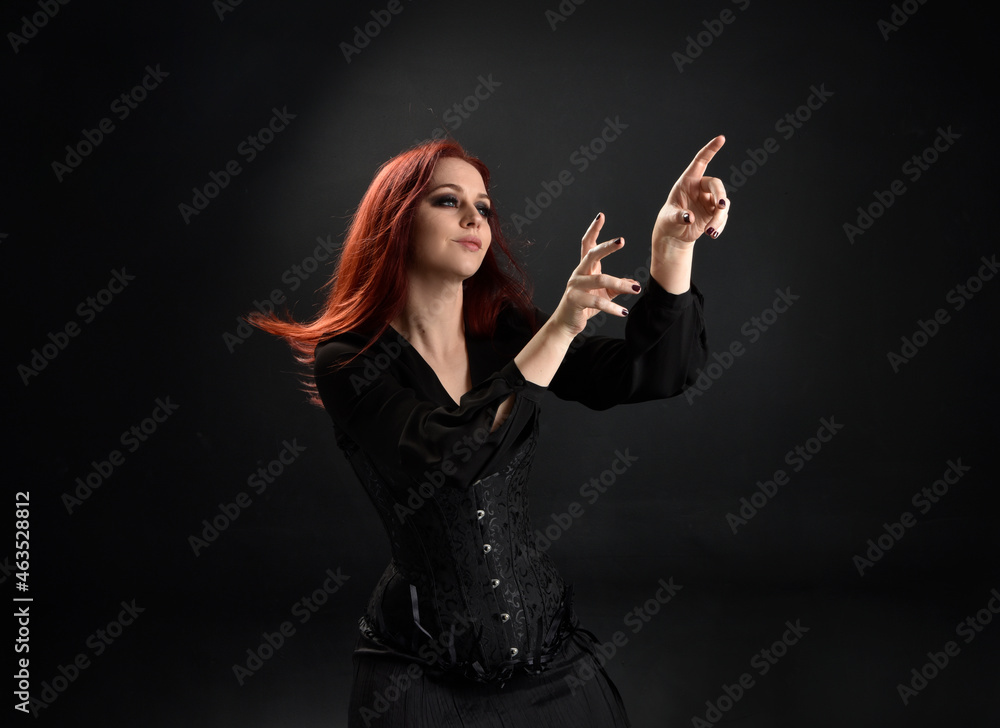 close up portrait of red haired woman wearing black victorian witch ...