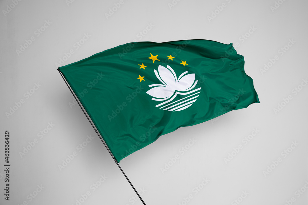 Macau flag isolated on white background. close up waving flag of Macau ...