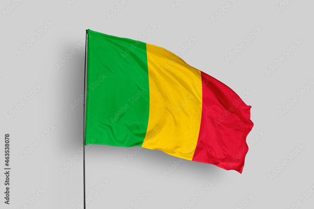 Mali flag isolated on the blue sky background. close up waving flag of ...