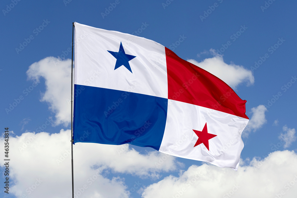 Panama flag isolated on the blue sky background. close up waving flag ...