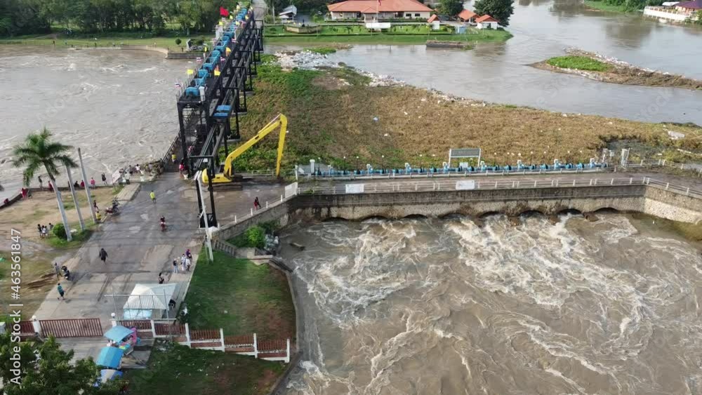 Aerial view of Rama 6 Dam (Phra Narai Gate) with powerful of water ...