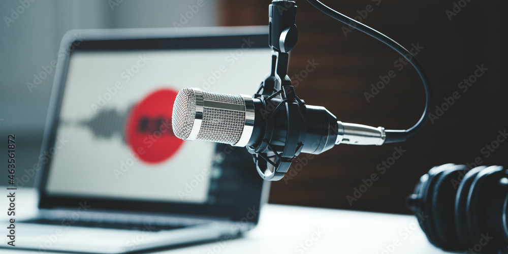 Podcast studio interior. Microphone, laptop, white desk and cozy ...