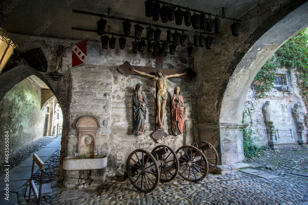 inside historic castle with wooden Jesus figure, three canons and two ...