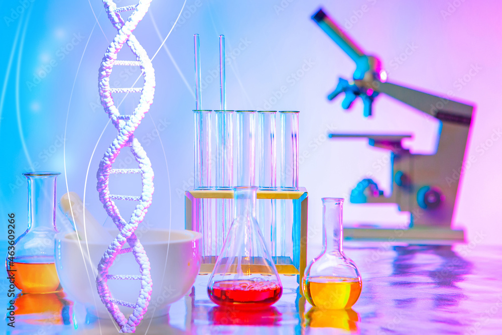 Ginetic laboratory work table. Microscope and medical test tubes are on ...