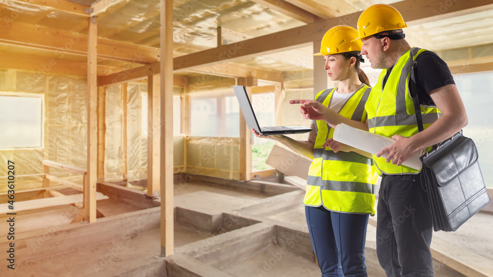 Two builders are discussing something. Builders meeting concept ...