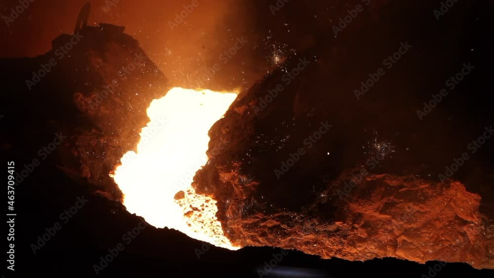 Ferrous metallurgy. Smelting iron at a metallurgical plant. A stream of ...