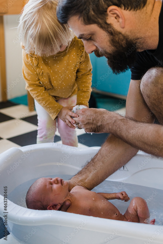 Baby first bath Stock Photo | Adobe Stock