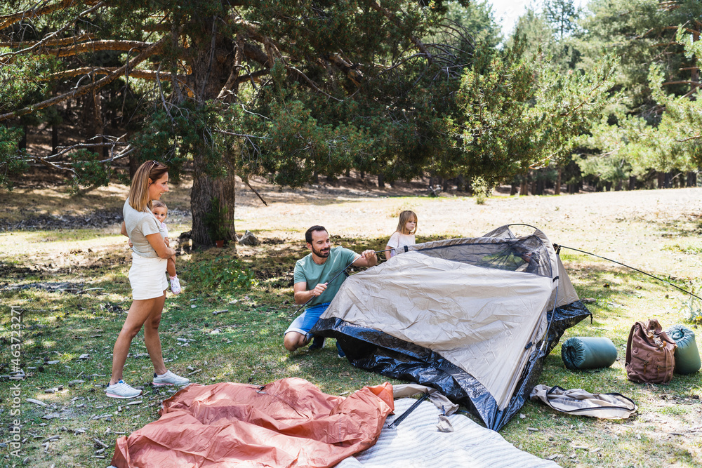 Family setting up tent in nature Stock Photo | Adobe Stock