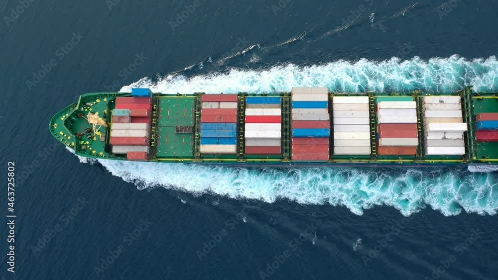 Container Ship ploughs through calm waters. Topmost complete deck ...
