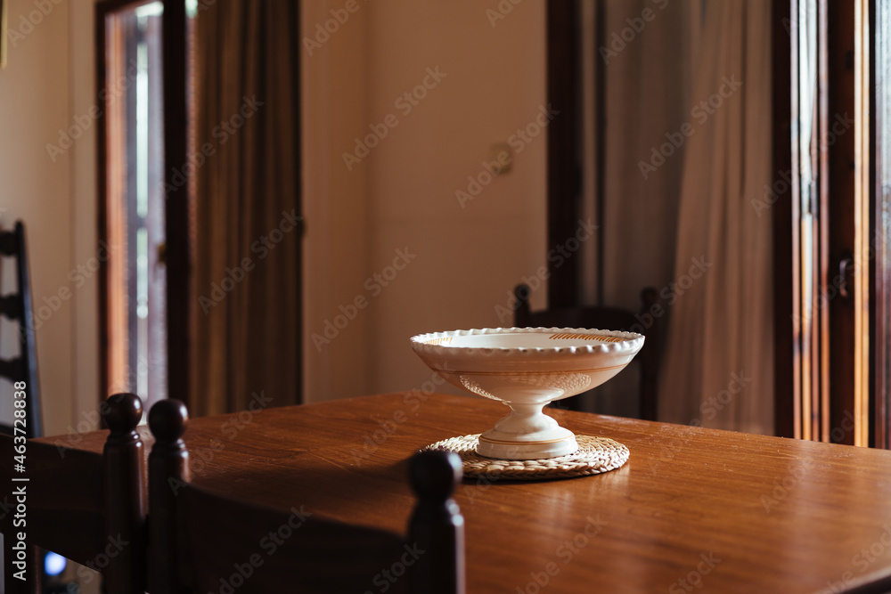 Decorative vase on a wooden table Stock Photo | Adobe Stock