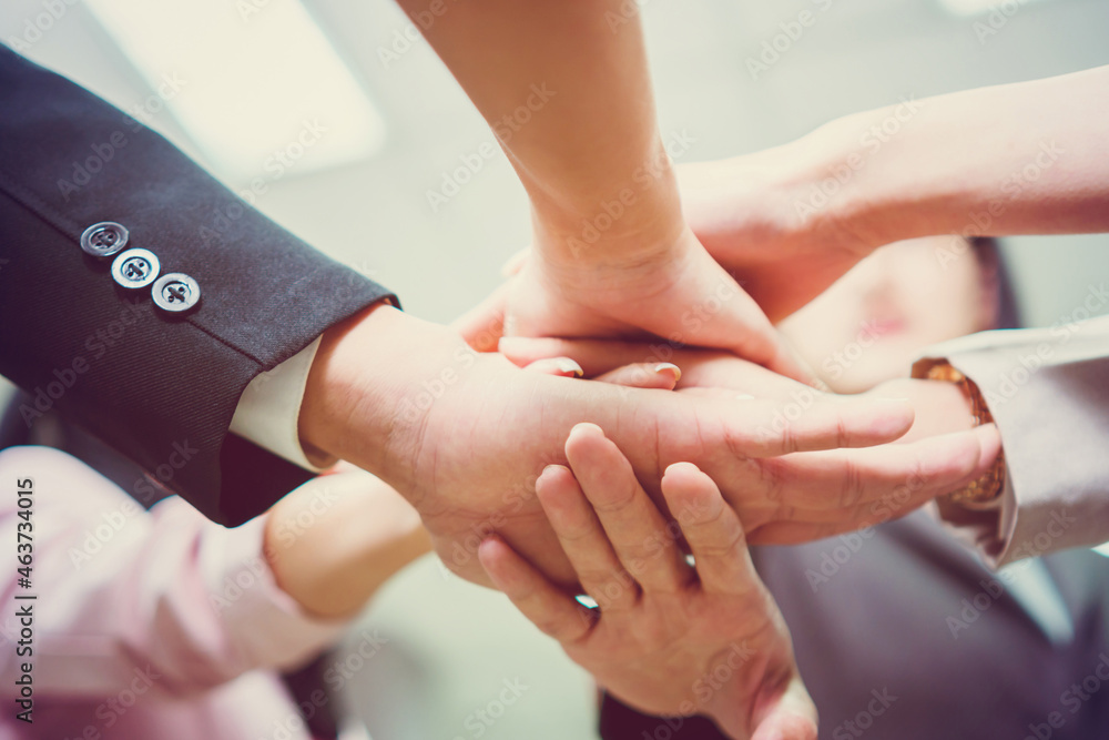 Success Teamwork Concepts, Business people with joined hands as a team ...