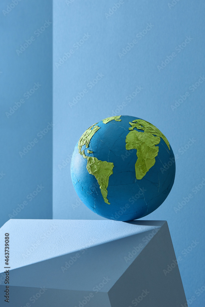 Earth globe on table with light Stock Photo | Adobe Stock