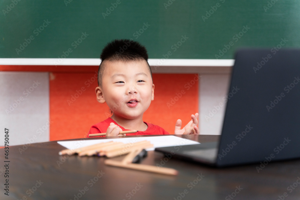 little boy writing Stock Photo | Adobe Stock
